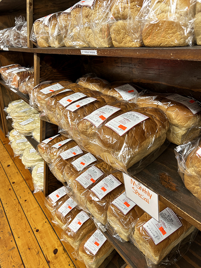 Freshly baked bread lined up with military precision, each loaf promising sandwiches that will make you question your relationship with grocery store bread forever.