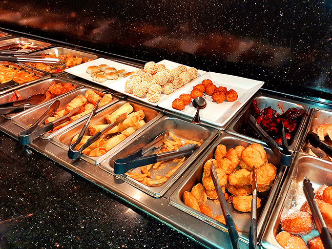 The appetizer section showcases golden-fried treasures and sesame-coated delights, each morsel a crispy ambassador of happiness.