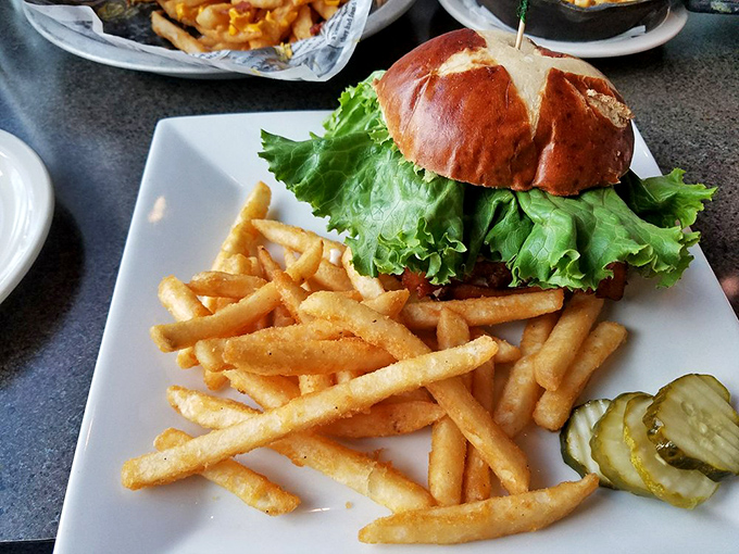This isn't just a burger&mdash;it's architecture with lettuce. The brioche bun deserves its own appreciation society.