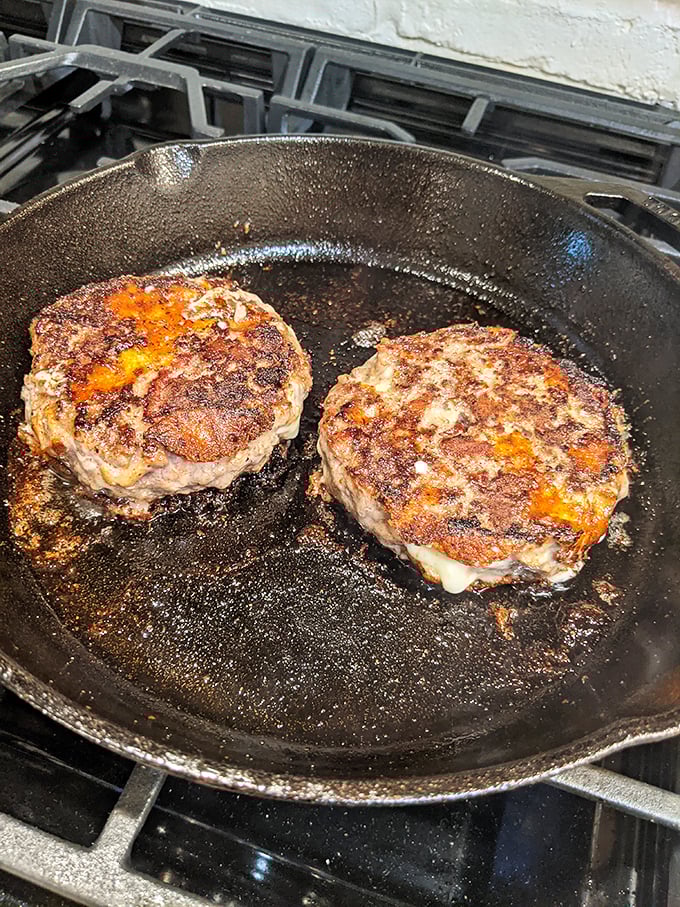 These aren't just hamburger patties – they're hand-formed promises of juicy perfection, sizzling their way to comfort food nirvana.