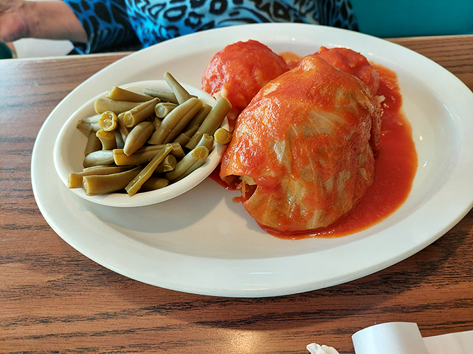 Cabbage rolls swimming in tomato sauce with a side of green beans&mdash;proof that vegetables can be comfort food when they're properly introduced to sauce.