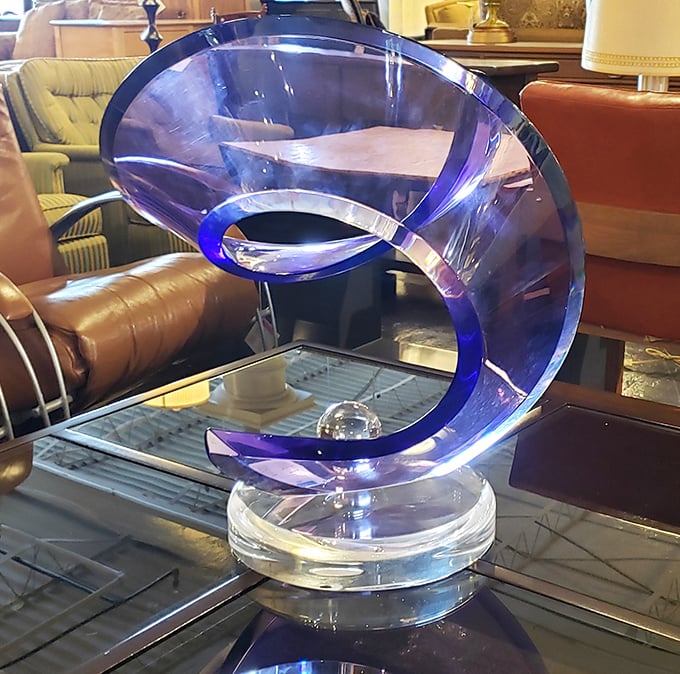 Blue acrylic sculpture that looks like it should be in MoMA but could be in your living room by dinner. Modern art meets functional conversation piece.