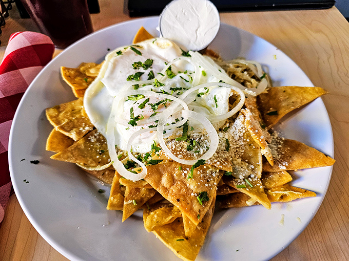 Chilaquiles that bring the fiesta to breakfast with crispy tortilla chips, eggs, and toppings that dance on your taste buds.
