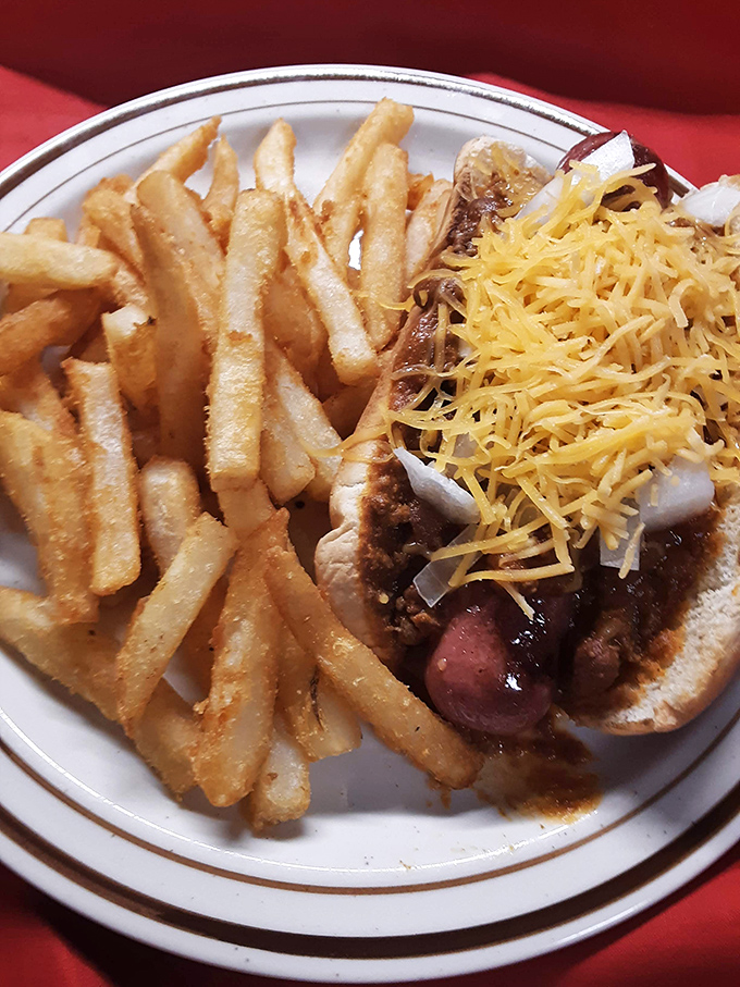 This chili cheese dog with golden fries isn't just lunch&mdash;it's edible nostalgia that takes you back to the best summer day of your childhood.