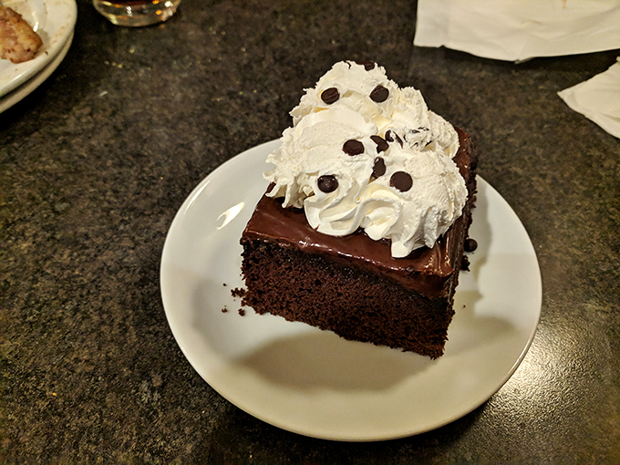 Chocolate cake with whipped cream and chocolate chips&mdash;because sometimes you need to eat your feelings, and those feelings are delicious.
