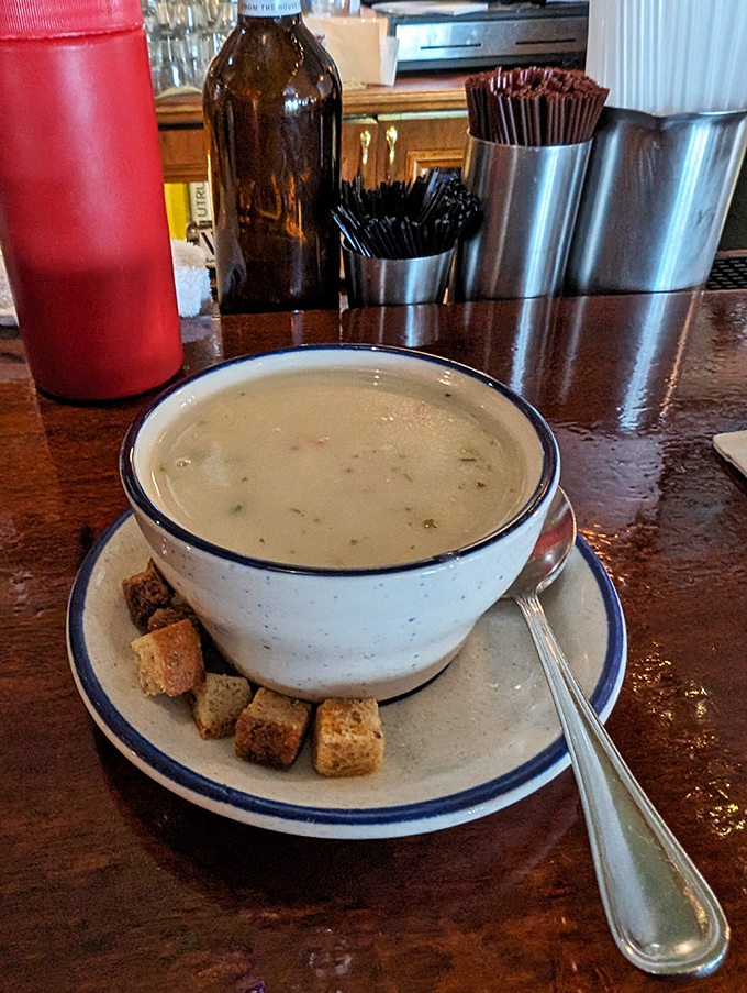 A bowl of clam chowder surrounded by house-made croutons&mdash;the kind of soup that makes you wish winter lasted just a little longer.