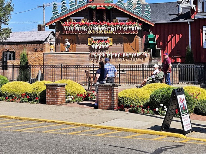 Visitors patiently await the hourly show, proving that in our instant-gratification world, we'll still happily wait for a giant wooden bird.