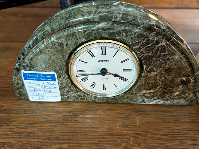 Time literally stands still with this elegant green marble desk clock—a sophisticated statement piece for any office or mantel.