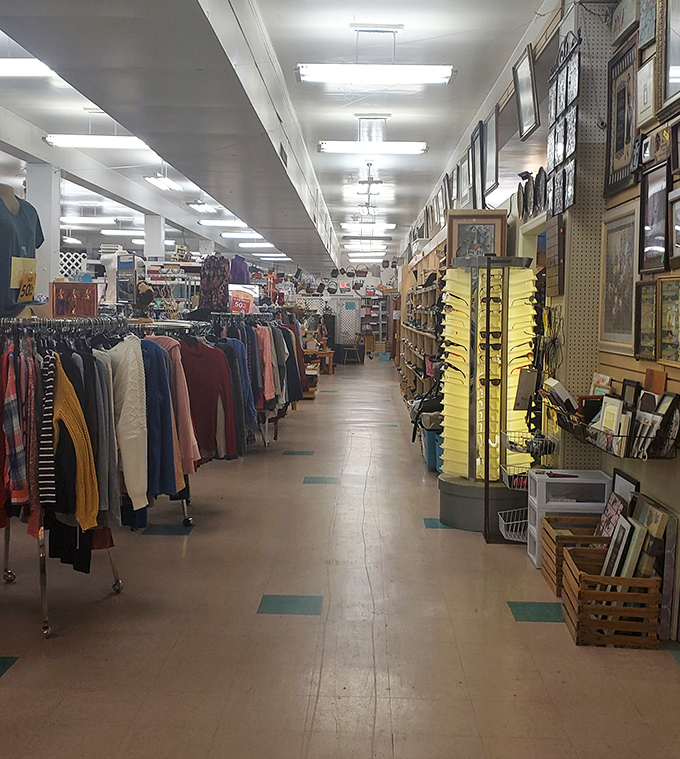 The main shopping corridor stretches like a runway of possibility, with clothing on one side and wall art on the other.