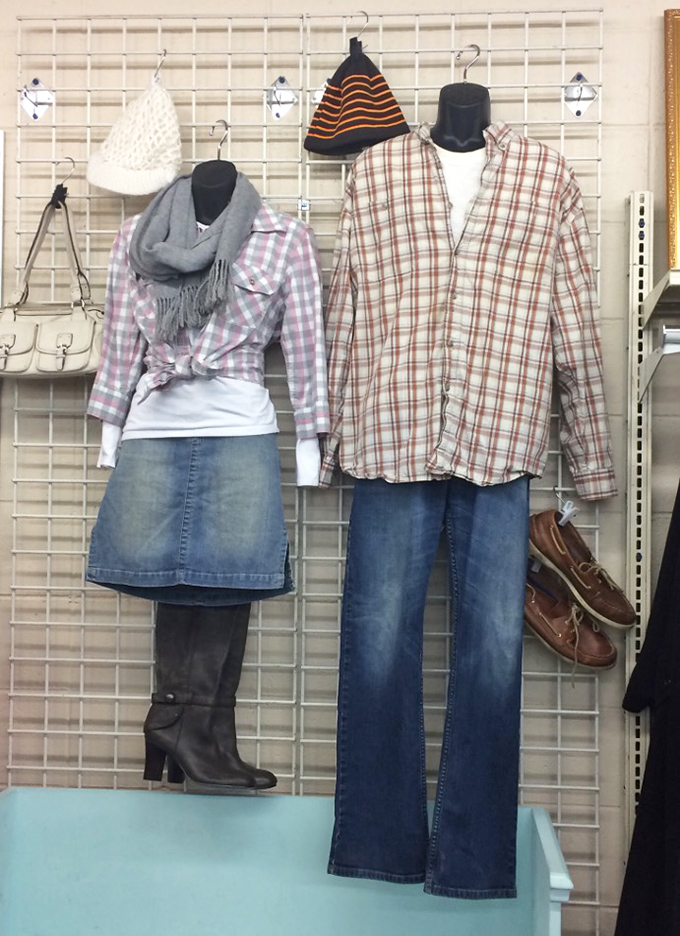 Curated outfit displays showcase the store's styling prowess—proof that secondhand doesn't mean second-rate in the fashion department.