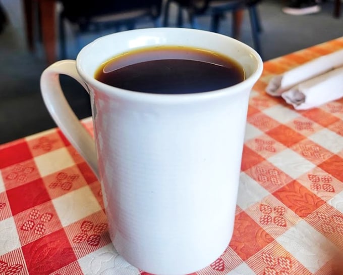 Coffee in a simple white mug&mdash;no pretentious vessels needed when the brew speaks volumes on its own.