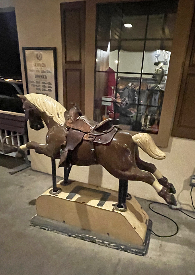 This vintage coin-operated horse stands guard near the entrance, a whimsical nod to the restaurant's frontier spirit.