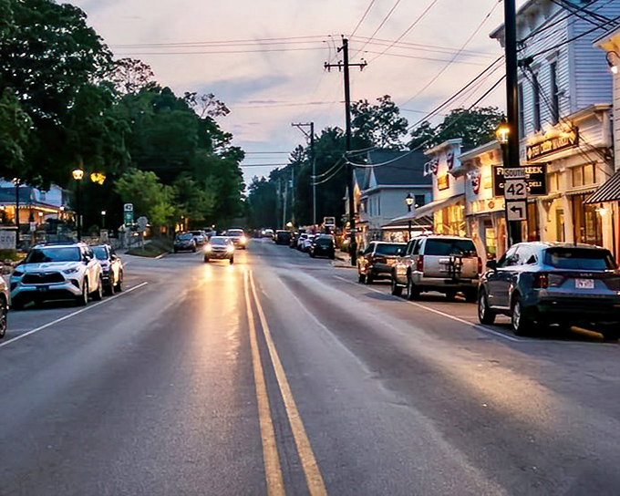 Dusk transforms Fish Creek's commercial district into a warm tableau of golden light, where dinner reservations become the hottest ticket in town.