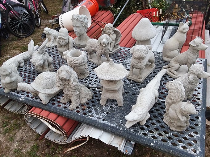 Garden guardians waiting for adoption. These concrete critters promise to watch over your flower beds with stony determination.