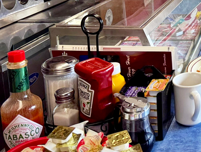 The condiment caddy&mdash;a miniature neighborhood of flavor enhancers&mdash;stands ready to customize your meal exactly the way you've liked it since childhood.