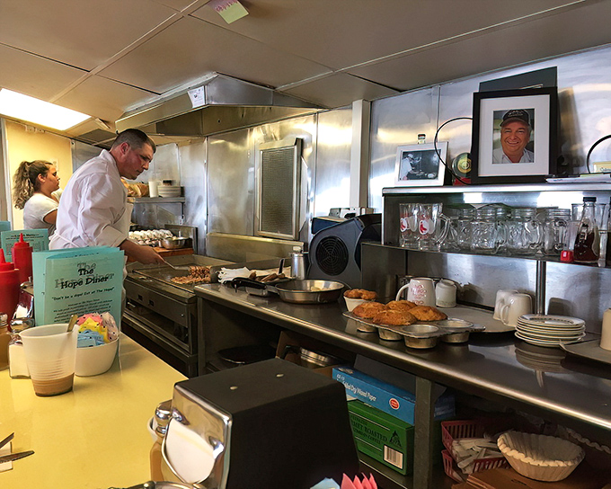 Behind the scenes magic where short-order wizardry happens on a well-seasoned grill that's seen thousands of perfect breakfasts.