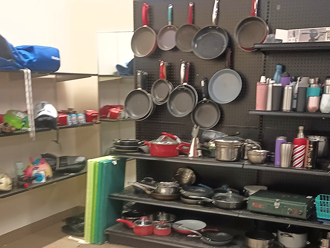Cookware hanging like modern art&mdash;proof that Julia Child's spirit lives on in these previously-loved pots and pans.