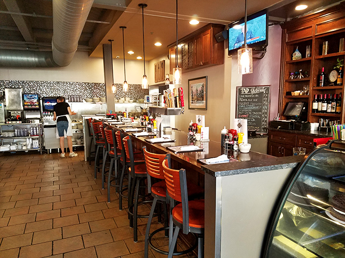 Counter seating for solo diners who know the best conversations happen between bites of perfectly crisped hash browns.