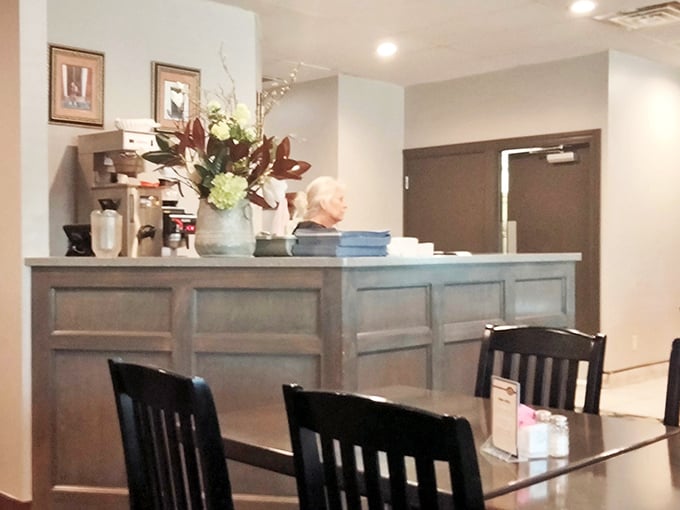 The heart of hospitality – Canal Grille's welcoming counter where reservations are made, to-go orders collected, and first-timers become regulars. Simple elegance that says "make yourself at home."