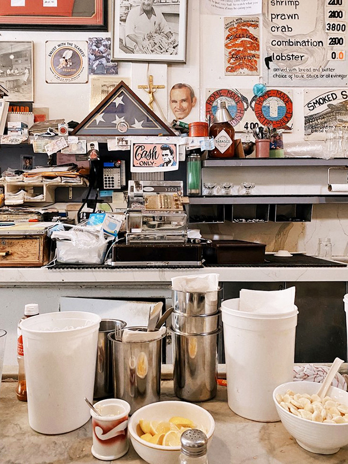 Behind the counter, where magic happens daily. The handwritten menu boards are living documents, changing with the tides and catches.