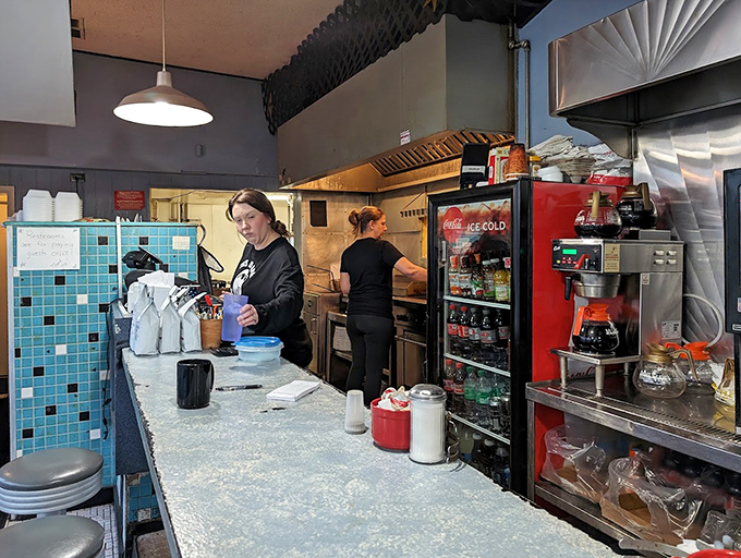 Behind the scenes magic happens at this counter, where breakfast dreams are fulfilled with efficiency that never sacrifices quality.