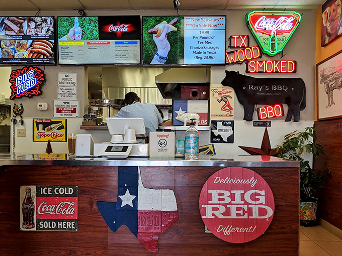 The counter where dreams come true, decorated with Texas pride and neon promises. That cow silhouette isn't just decoration&mdash;it's a memorial.