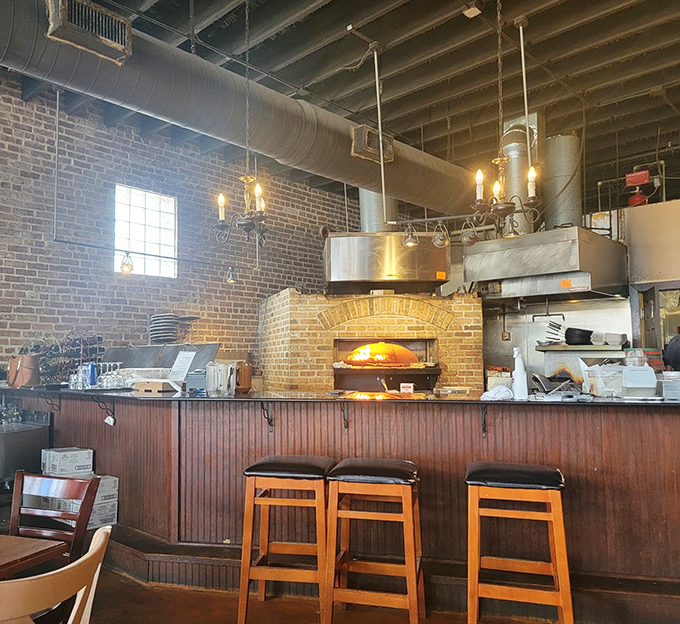 Bar seating facing the open kitchen means you get dinner and a show without paying extra for admission.