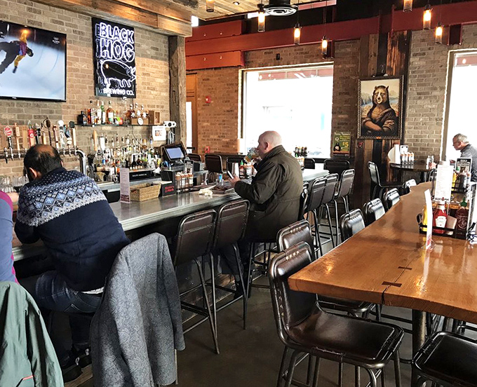 A bar where strangers become friends, united by the universal language of "Did you try the brisket yet?"