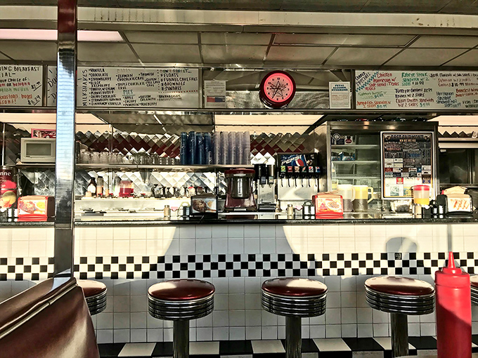 The counter where magic happens &ndash; gleaming chrome, spinning stools, and the promise of friendly conversation that's been the heart of American diners since the Eisenhower administration.
