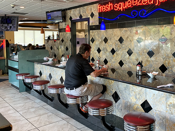 Counter seating: where solo diners become breakfast philosophers and the coffee refills flow like conversation with an old friend.