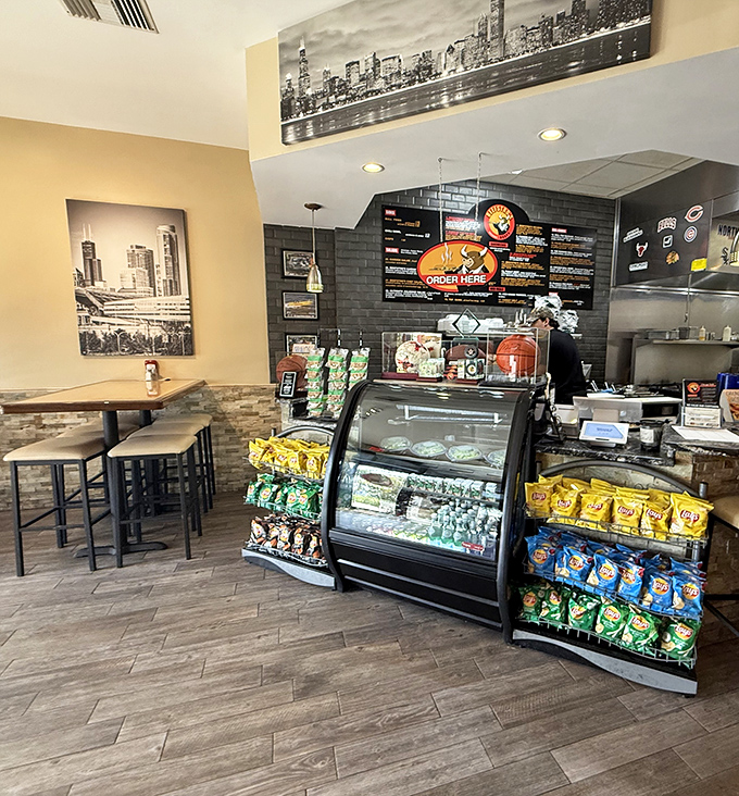 The counter area showcases Chicago skyline art and chip racks &ndash; because sometimes you need a little something extra with your sandwich.