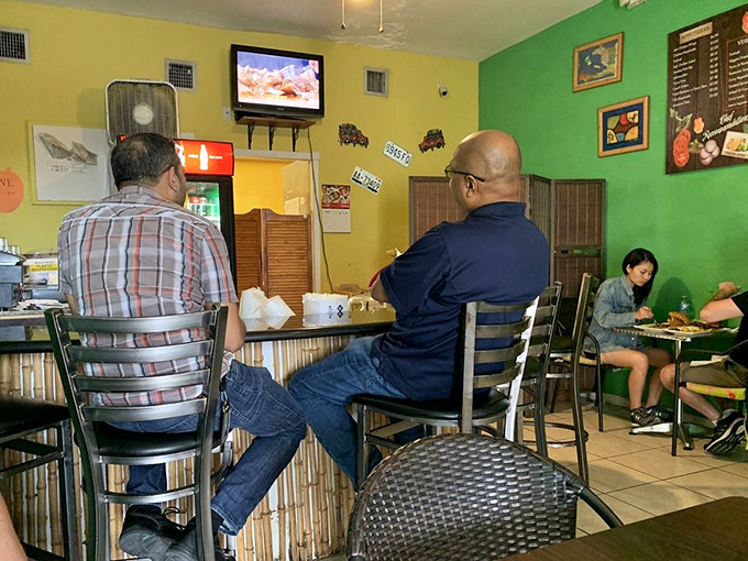 The ordering counter where Caribbean magic begins, one perfectly seasoned dish at a time for hungry souls.