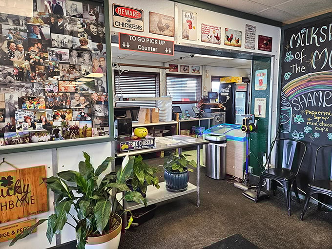 The pickup counter wall tells decades of community stories through photos&mdash;a visual guestbook of Anchorage's chicken-loving faithful.