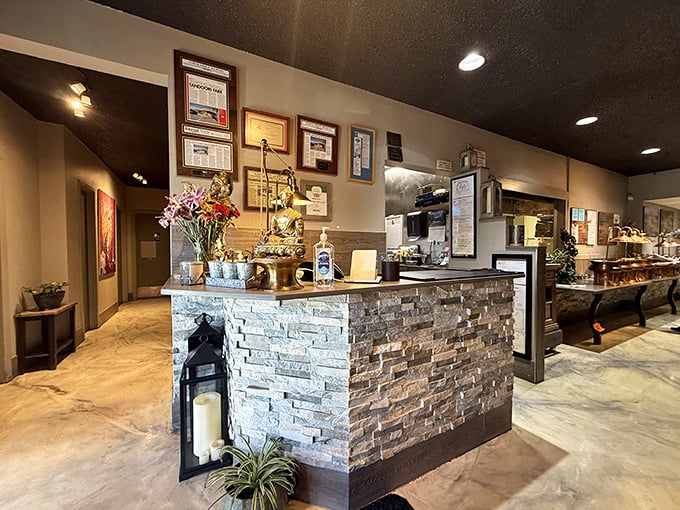 The reception counter welcomes you with stone-faced elegance, but the aromas beyond promise warm hospitality.