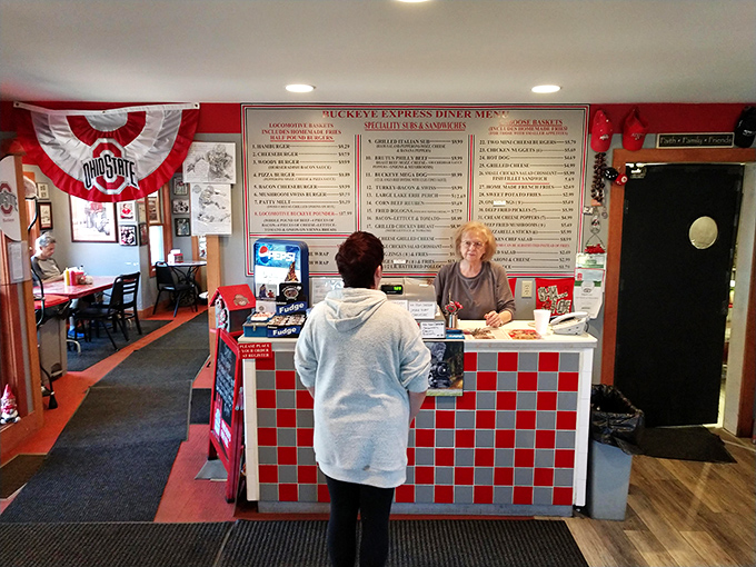 The nerve center of deliciousness, where Ohio State pride meets diner efficiency. Every great meal begins with a friendly face at this counter.