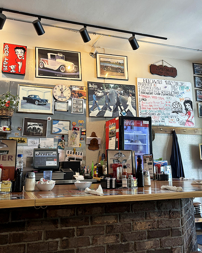 The wall behind the counter&mdash;a gallery of memories, music, and Midwestern pride. That Beatles Abbey Road poster says, "All you need is breakfast."