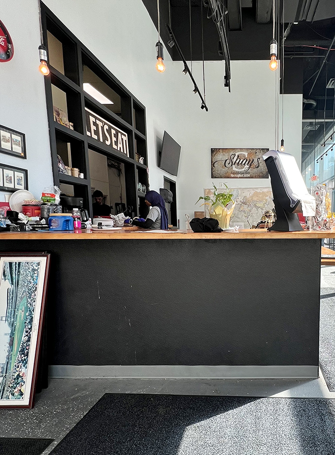 Where sandwich magic happens. The "LET'S EAT" sign isn't just decoration&mdash;it's the most sensible advice you'll receive all day.