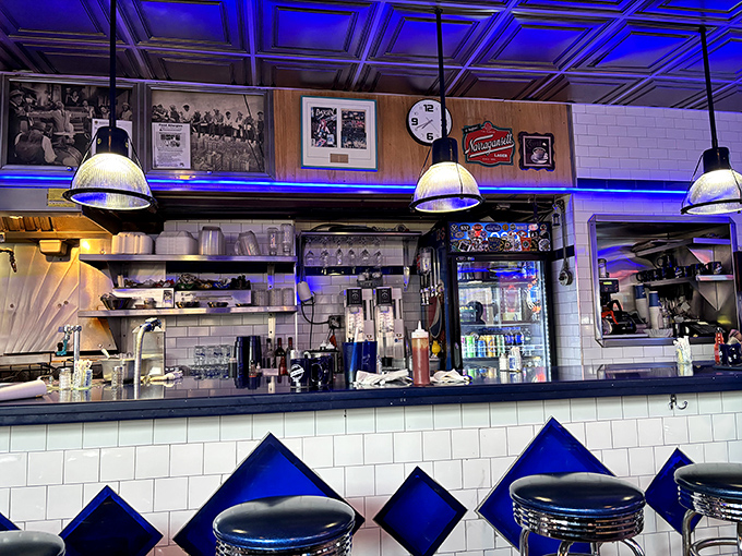 Behind the counter where diner magic happens. Those pendant lights have witnessed more late-night confessions than a priest.