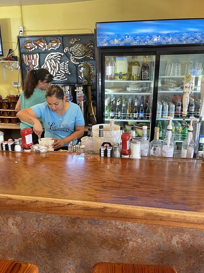 Behind the counter, the real magic happens – where coffee is always brewing and servers perform the daily ritual of turning ingredients into memories.