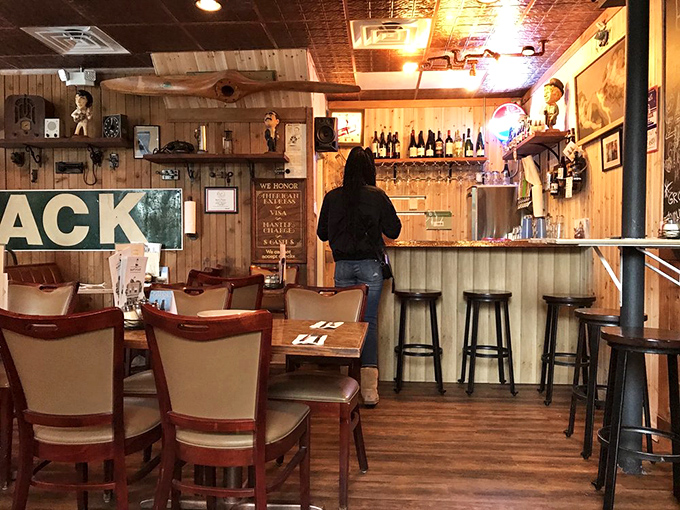 The bar area waits for the evening rush, wood-paneled and ready to welcome regulars who don't even need to glance at the menu.