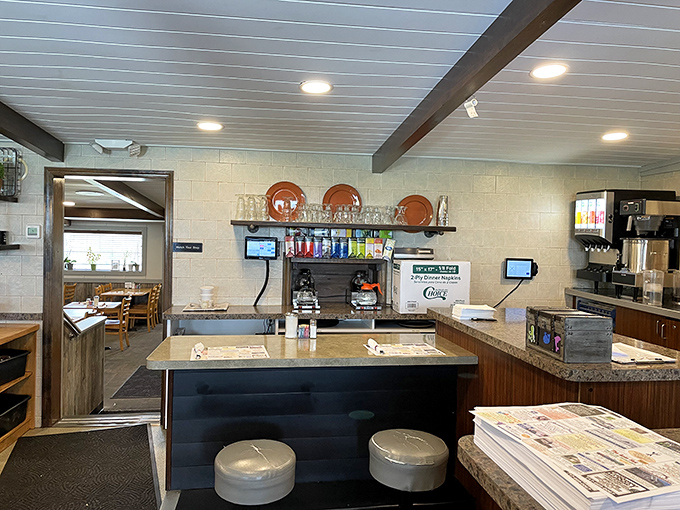 The counter where magic happens &ndash; copper pans hanging like medals of honor above the battlefield of breakfast.