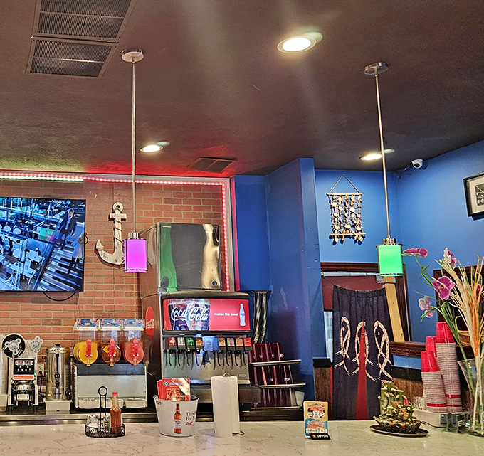 The counter area blends functionality with maritime charm. That ship's wheel isn't just decoration&mdash;it's steering you toward flavor country.