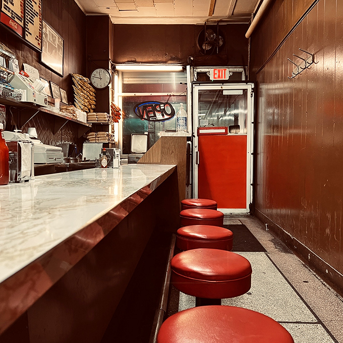 These red stools have supported generations of Detroiters, each one a front-row seat to the timeless performance of short-order cooking.