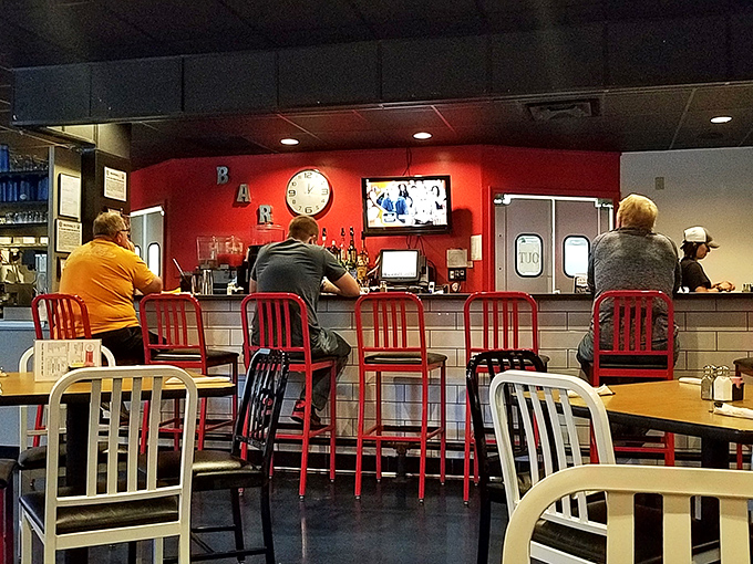 The counter seating offers front-row tickets to the culinary show, where regulars exchange local gossip like it's valuable currency.