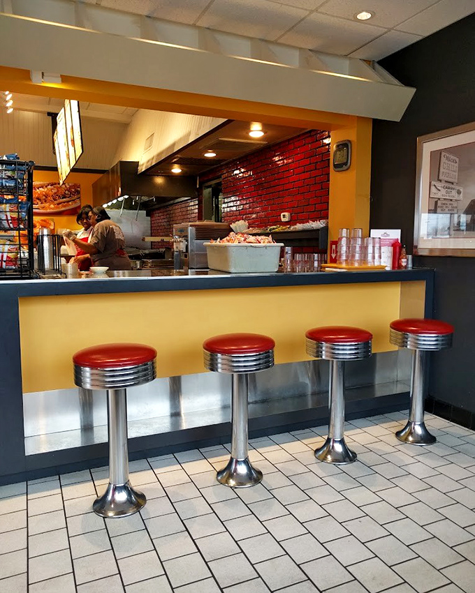 Counter seating that invites solo diners to become part of the Nick's family, where the red stools have witnessed decades of local gossip.