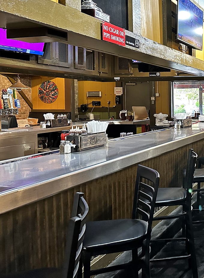 The bar area – where barbecue dreams are discussed, debated, and ultimately devoured. Notice the no smoking sign? Ironic in a smokehouse.