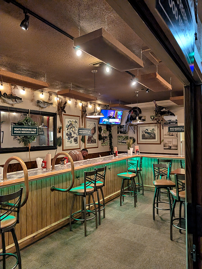 Where fishing tales grow taller—a bar area designed for casual meals and conversations, surrounded by tributes to the waters that feed us.