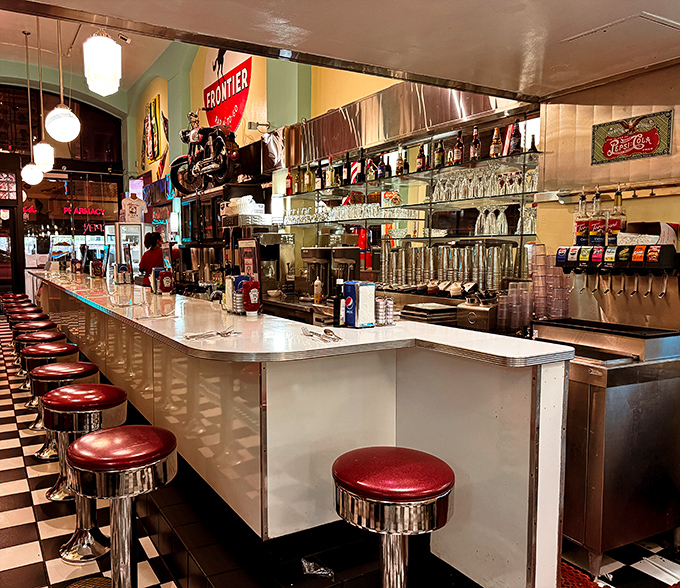 The counter where solo diners become temporary family, where coffee refills flow freely, and where the best diner stories are exchanged.
