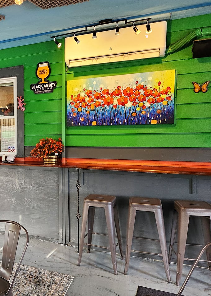 Art that feeds the soul while you feed the body. That vibrant floral painting against Peachtree's signature green is Instagram gold.