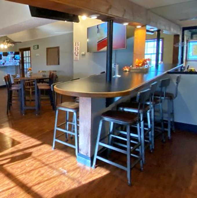 Counter seating bathed in golden sunlight &ndash; where BBQ dreams and afternoon beams come together for a perfect Colorado dining moment.